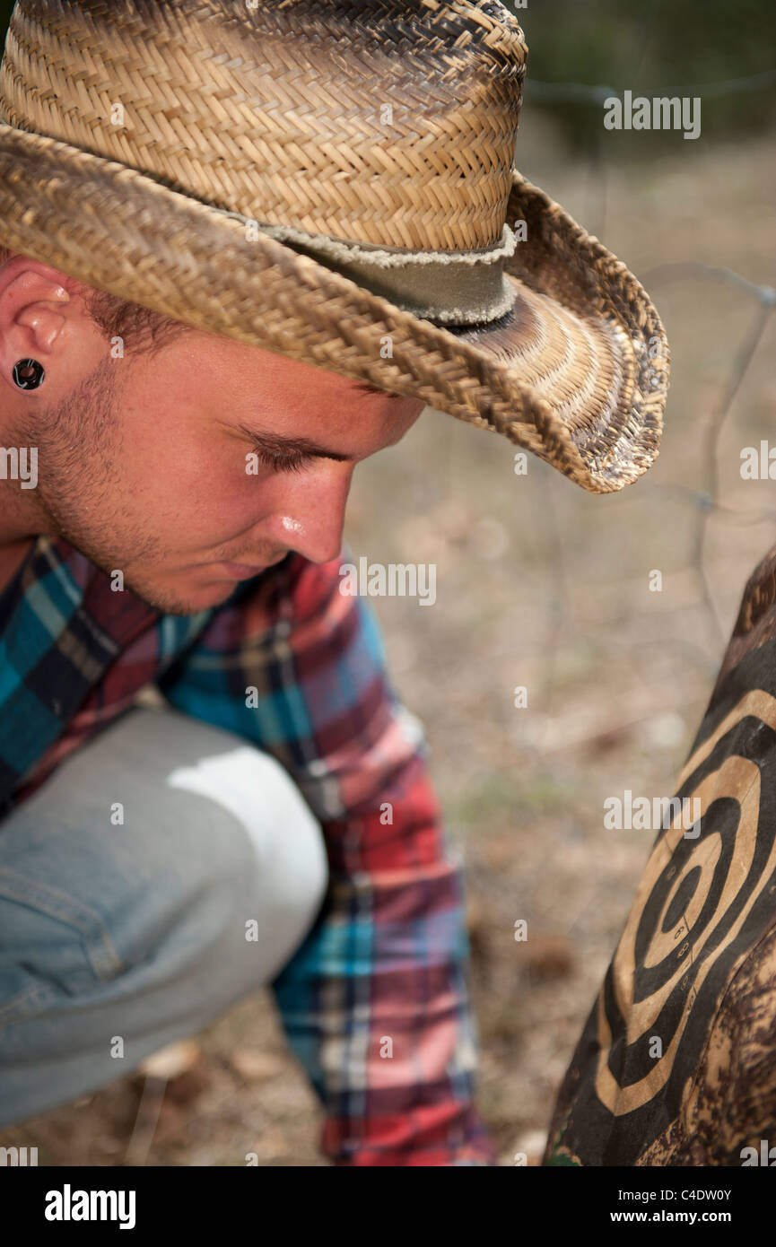 Young man hunting Stock Photo - Alamy