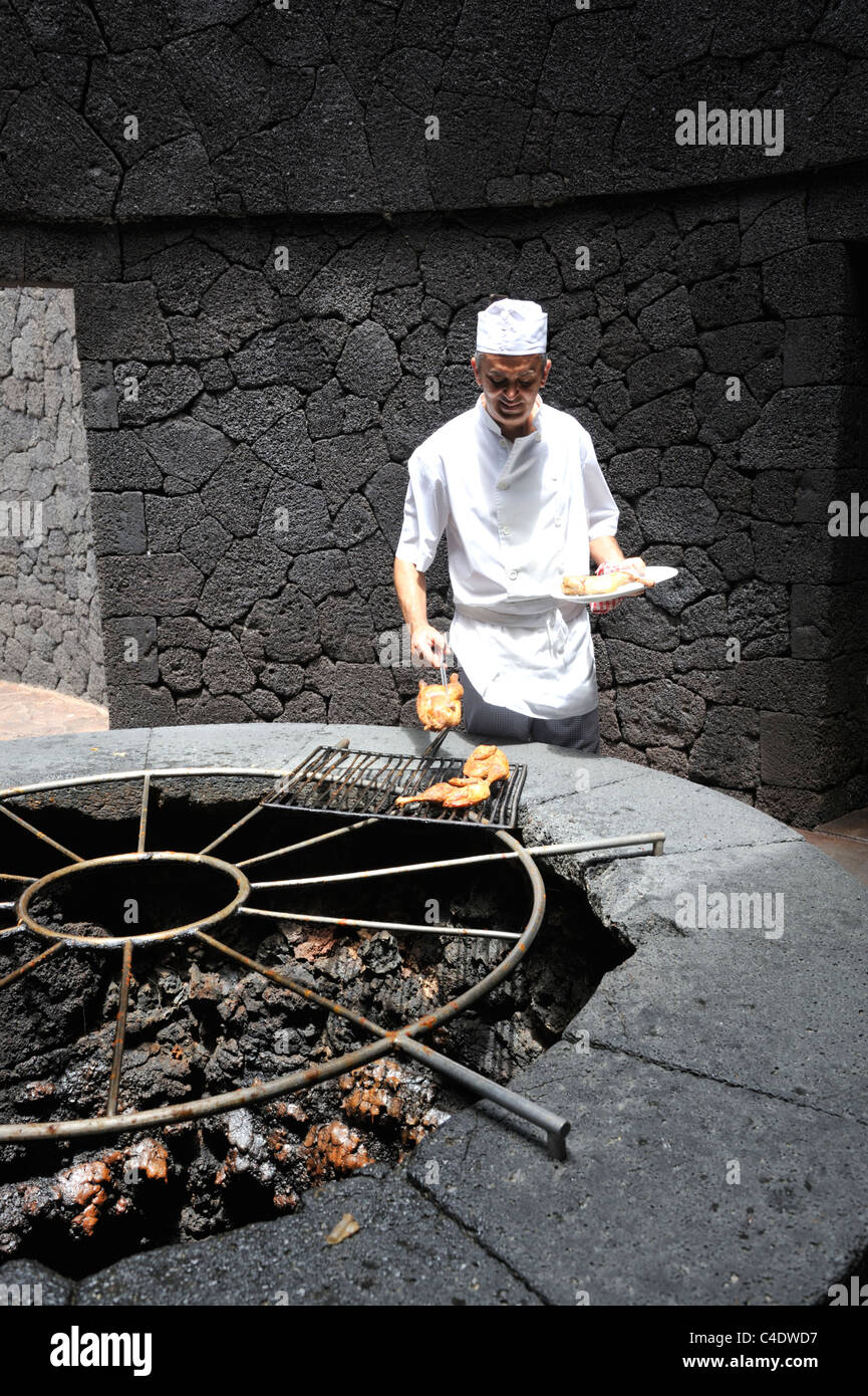 Chef cooking over volcanic heat El Diablo restaurant, Timanfaya ...