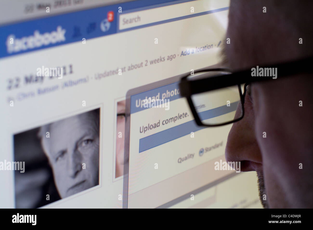 Male uploading photos to Facebook, Facebook now employs face ...