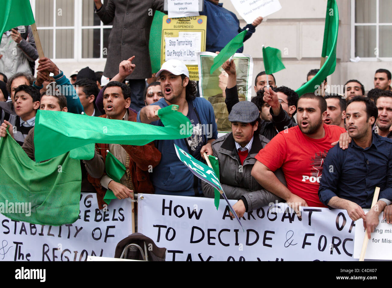 Pro-Gaddafi protesters outside a conference of countries enforcing a no ...