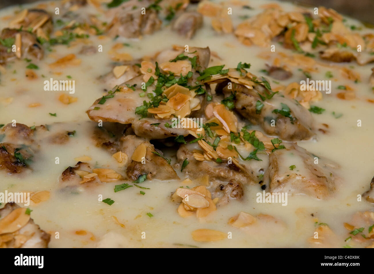 Beef stew with coconut milk and sliced almonds Stock Photo - Alamy