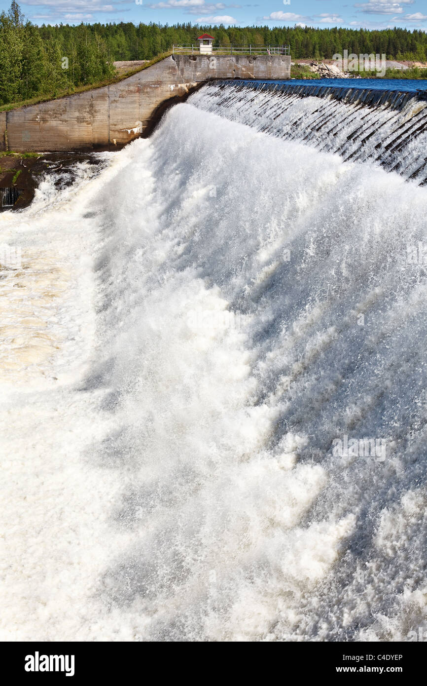Owerflow of water on the man-made storage pond in Karelia, Russia. Semi ...