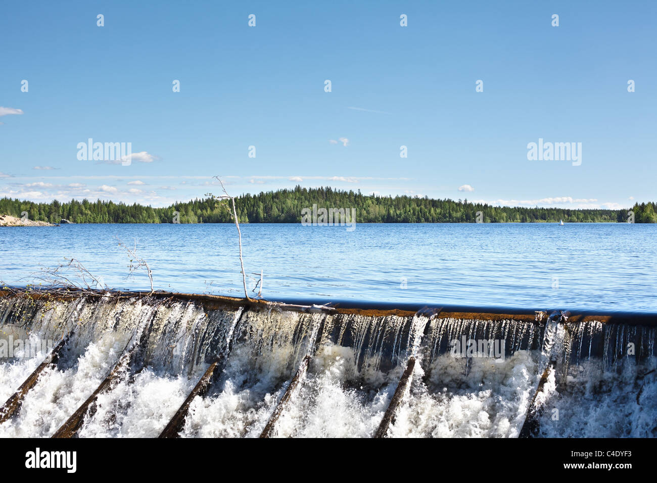 Owerflow of water on the man-made storage pond in Karelia, Russia. Semi ...
