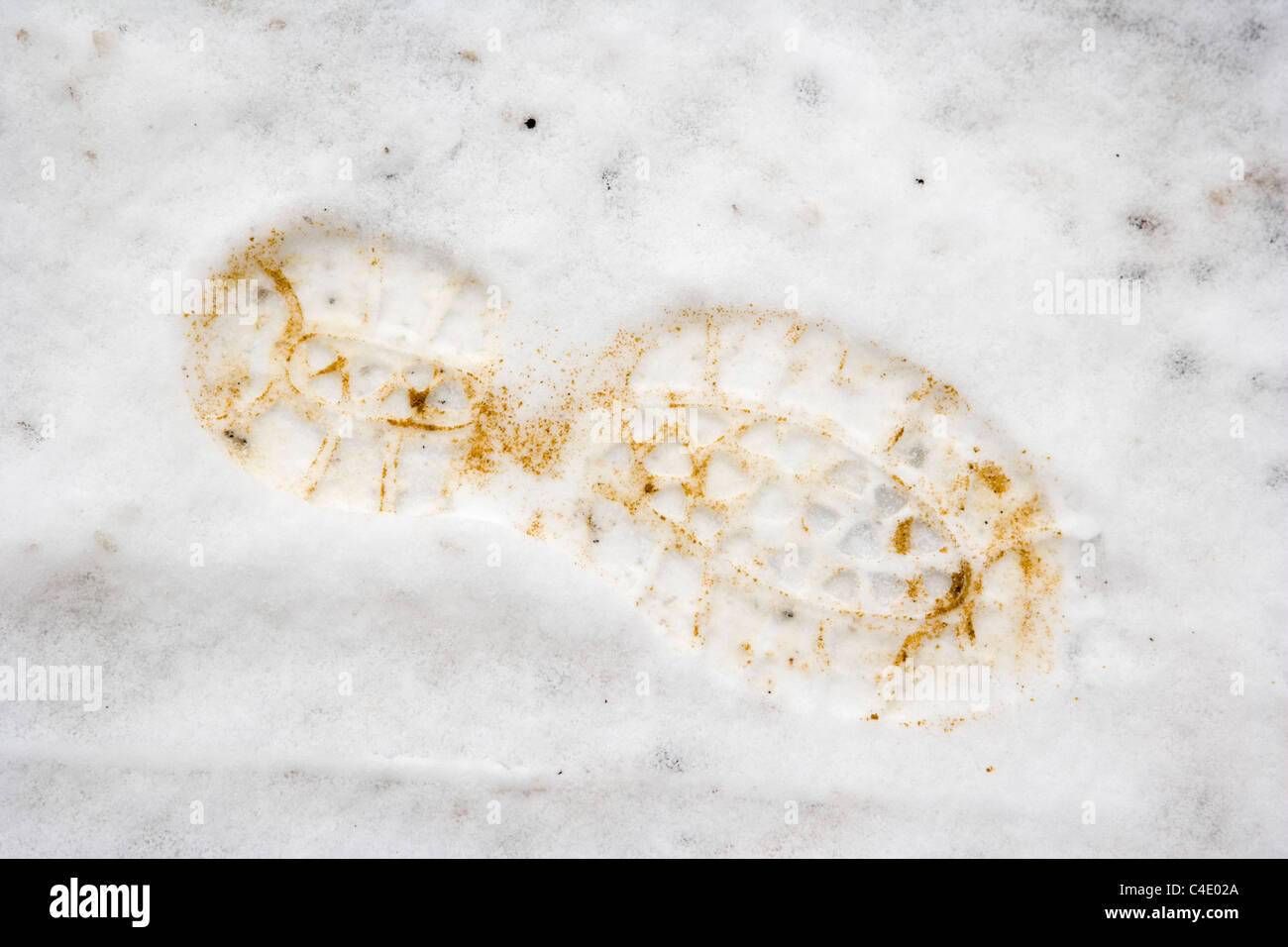 Sandy boot trace on snow Stock Photo - Alamy