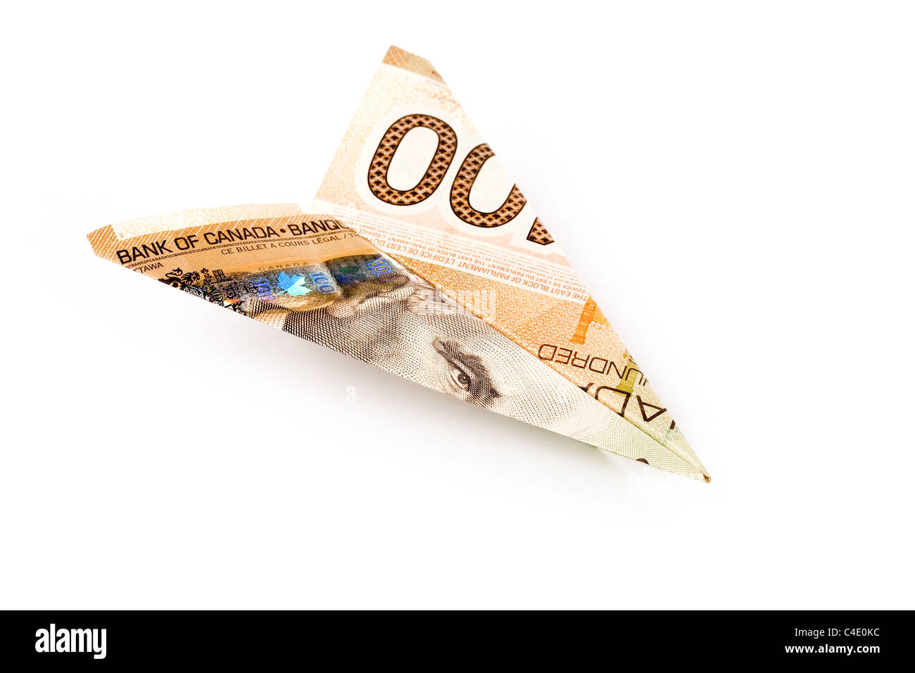 canadian dollar paper airplane, business concept Stock Photo - Alamy