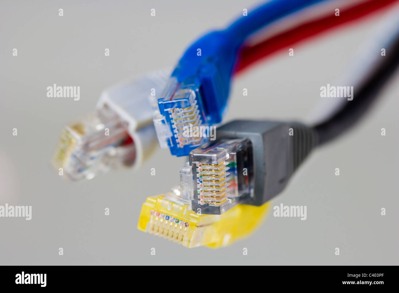 Four RJ-45 Ethernet connectors on white background Stock Photo - Alamy