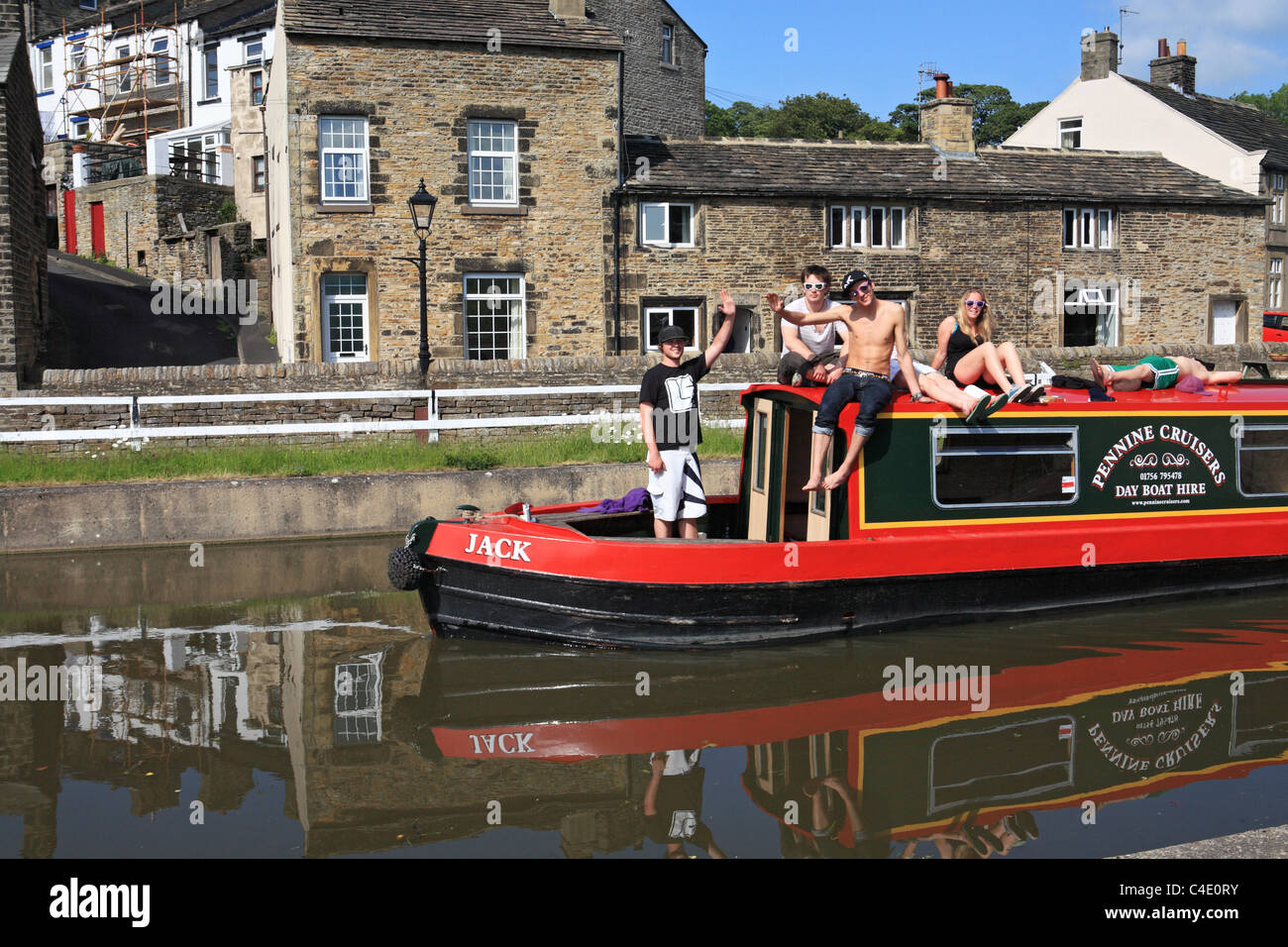 Young people aboard a boat on the Leeds and Liverpool canal at Kildwick ...
