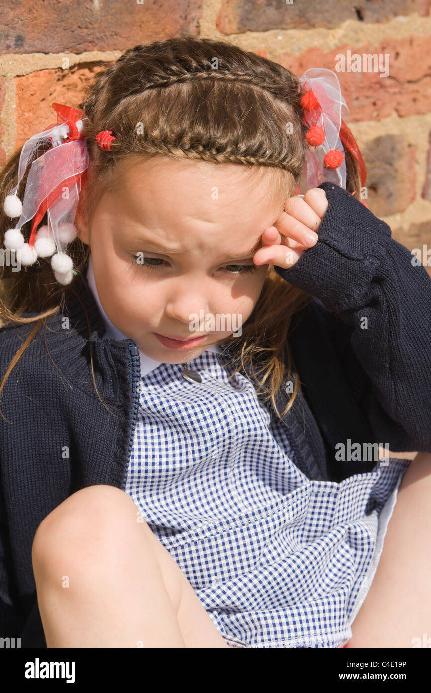 4 years old schoolgirl in gingham dress, summer school uniform Stock ...
