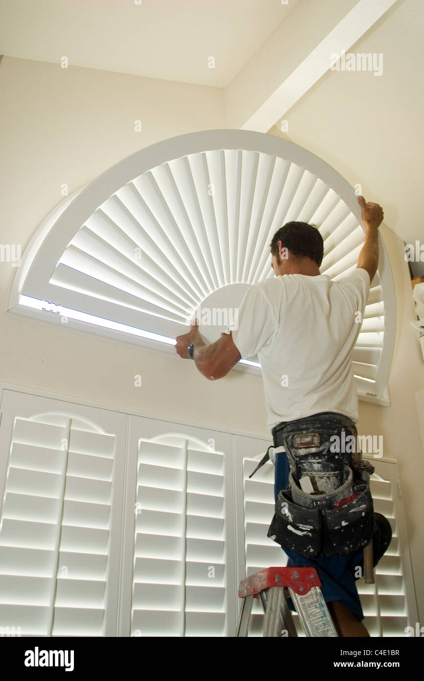 Installing shutters hi-res stock photography and images - Alamy