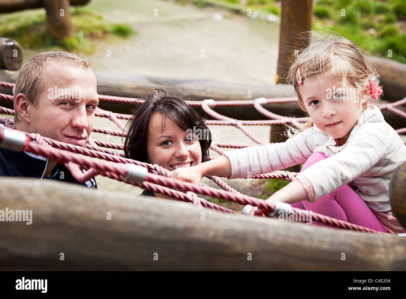 happy family on the playground Stock Photo - Alamy