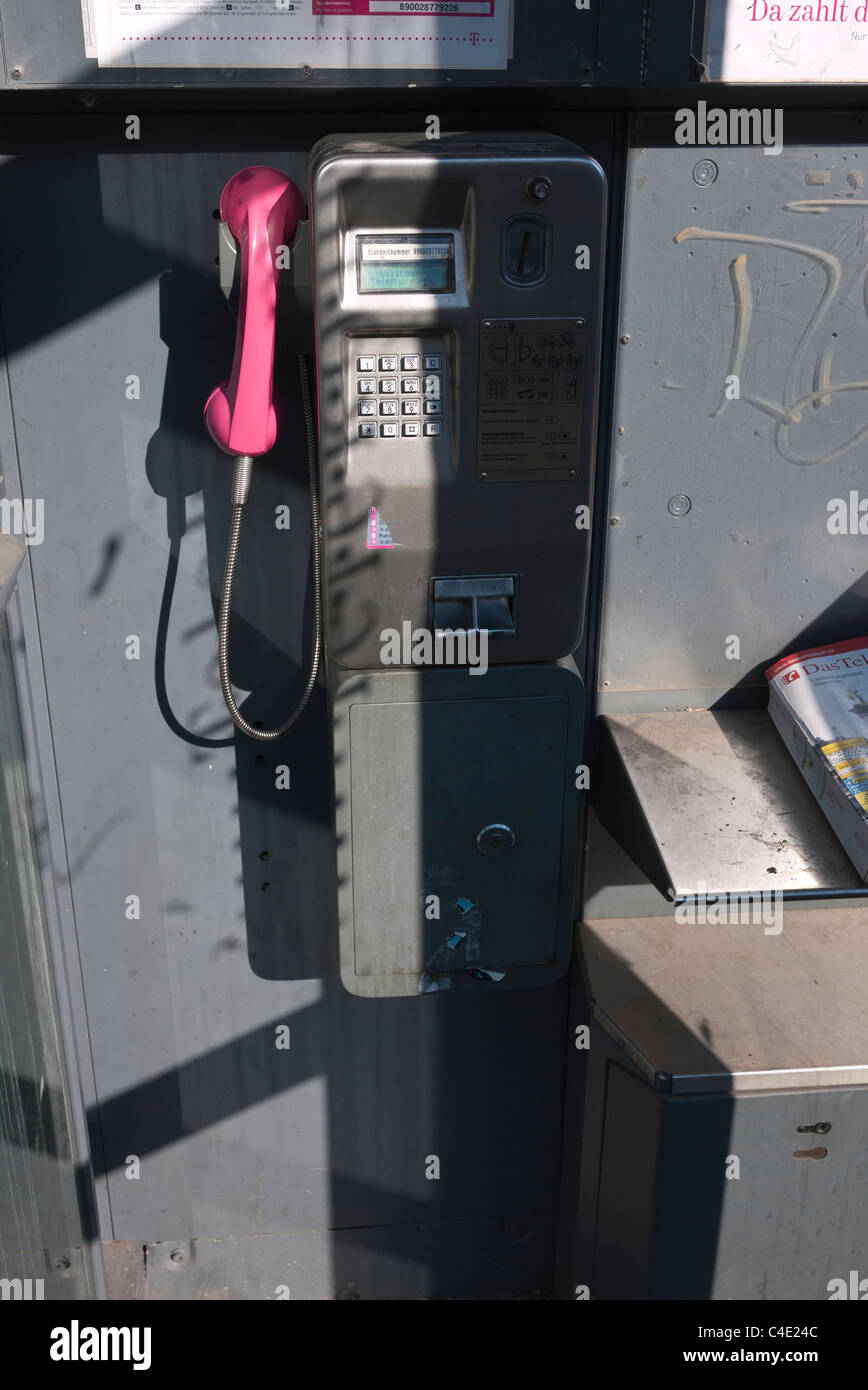 Traditional phone booth in Munich, Germany with pink phone receiver ...