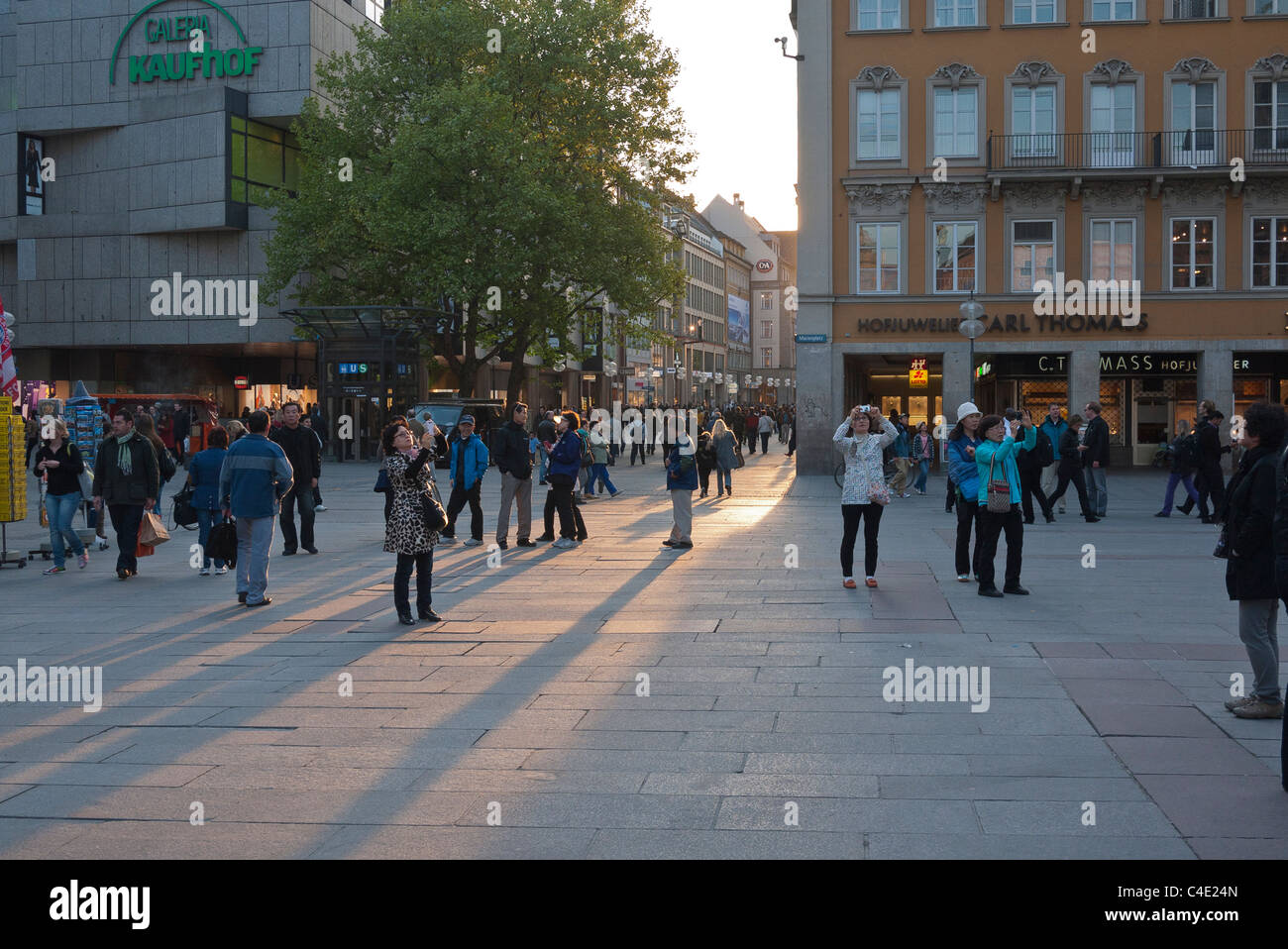People walking along the pedestrian mall leading to the city center ...