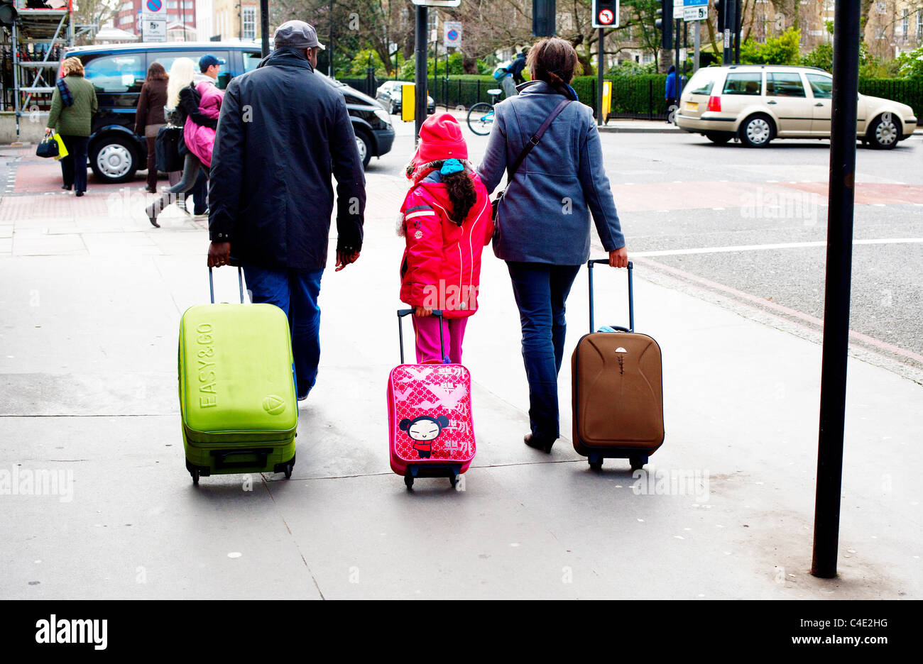 Family group pulling suitcases, London, England, UK, Europe Stock Photo ...
