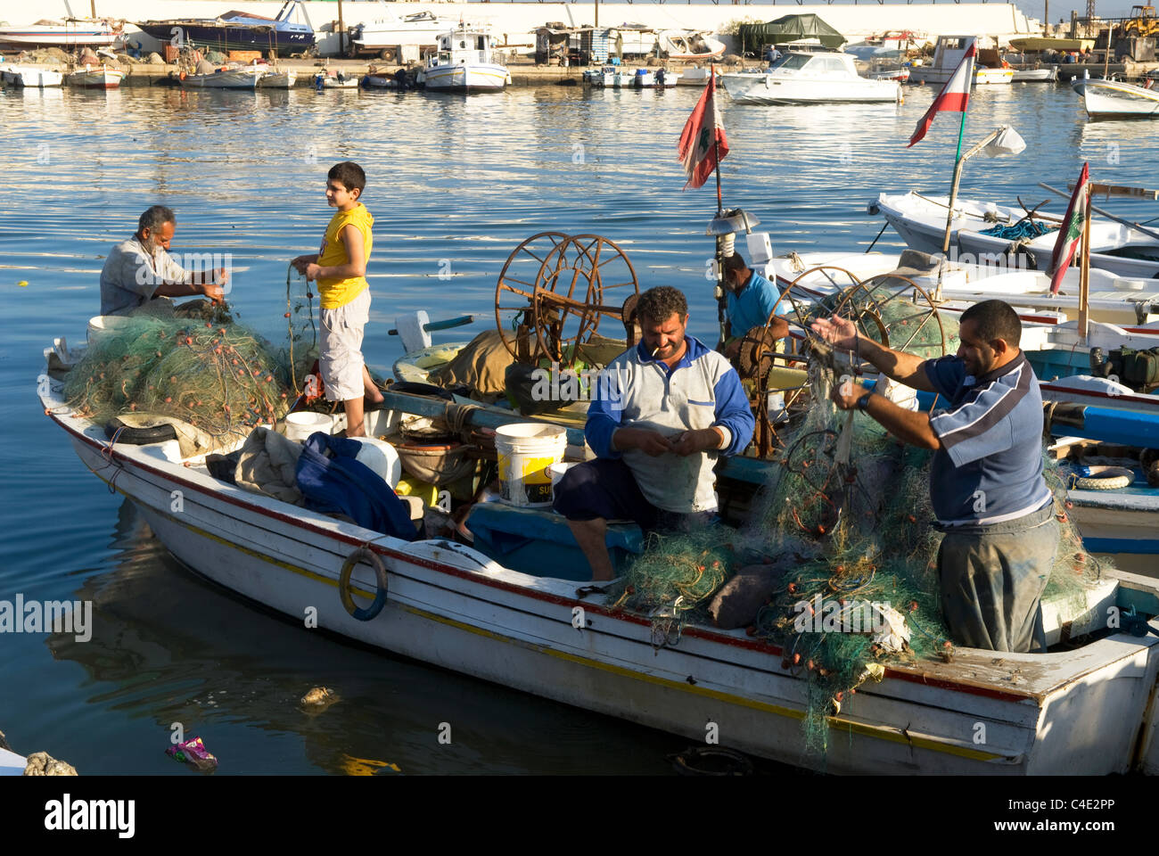 Fishermen tending their nets, port, Sidon, southern Lebanon Stock Photo ...
