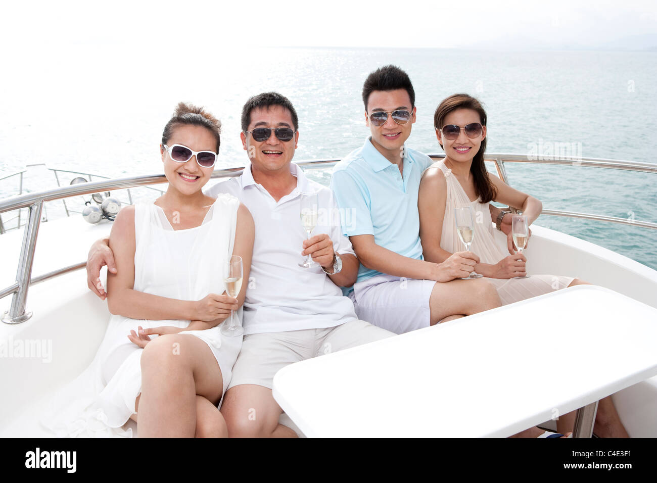Friends Relaxing on a Yacht Stock Photo - Alamy