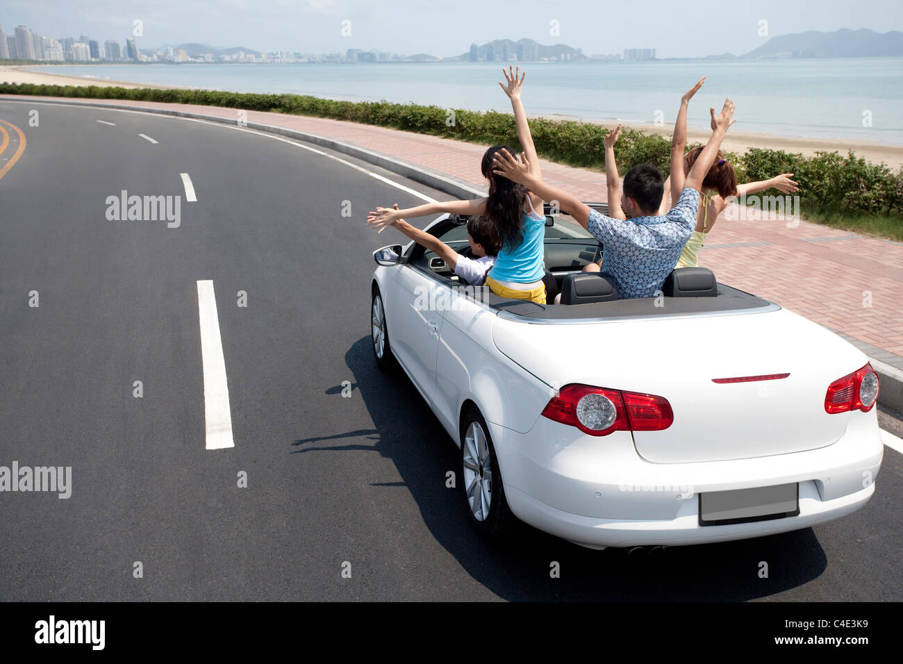 Friends Having Fun in a Convertible Stock Photo - Alamy