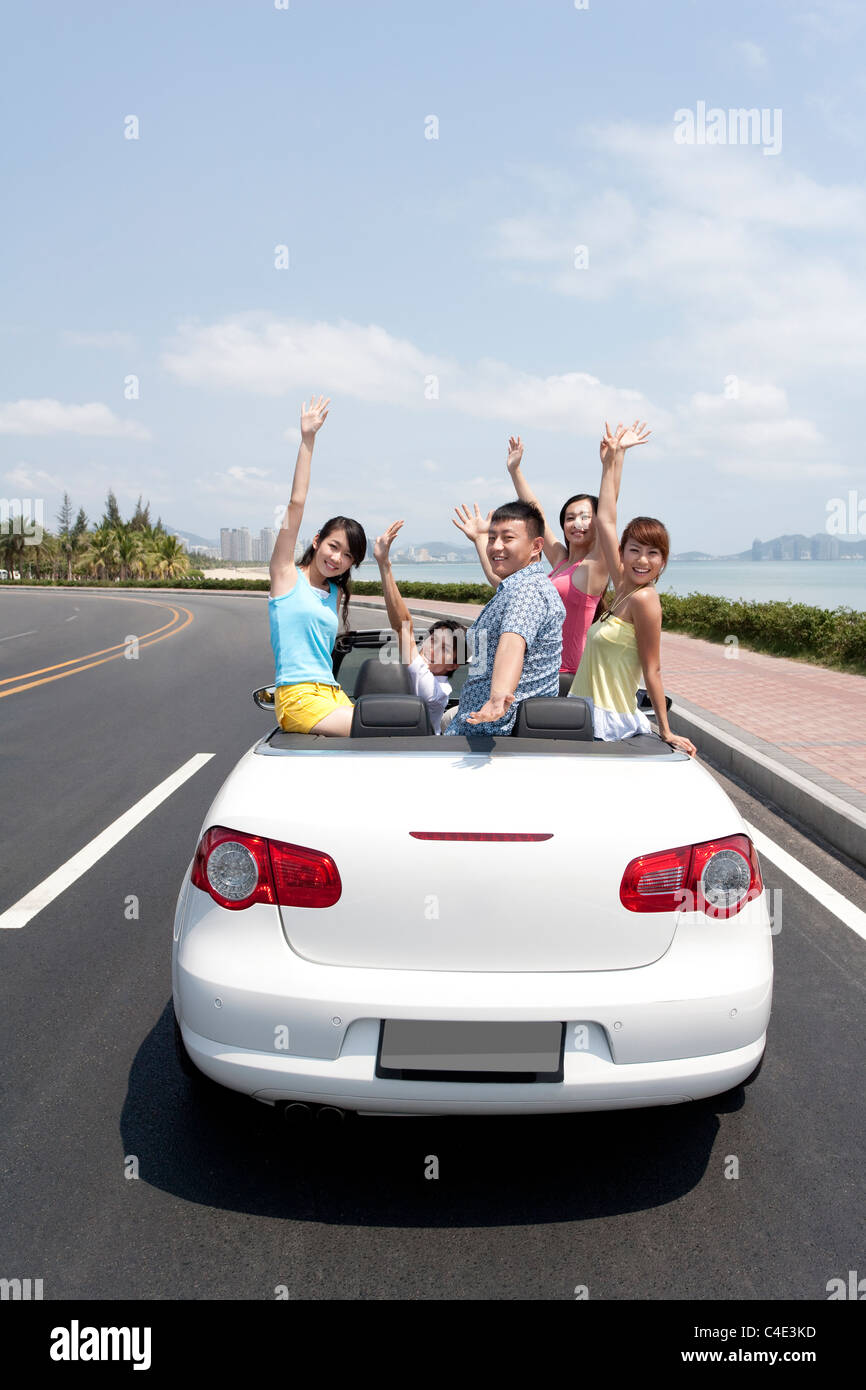 Friends Having Fun in a Convertible Stock Photo - Alamy