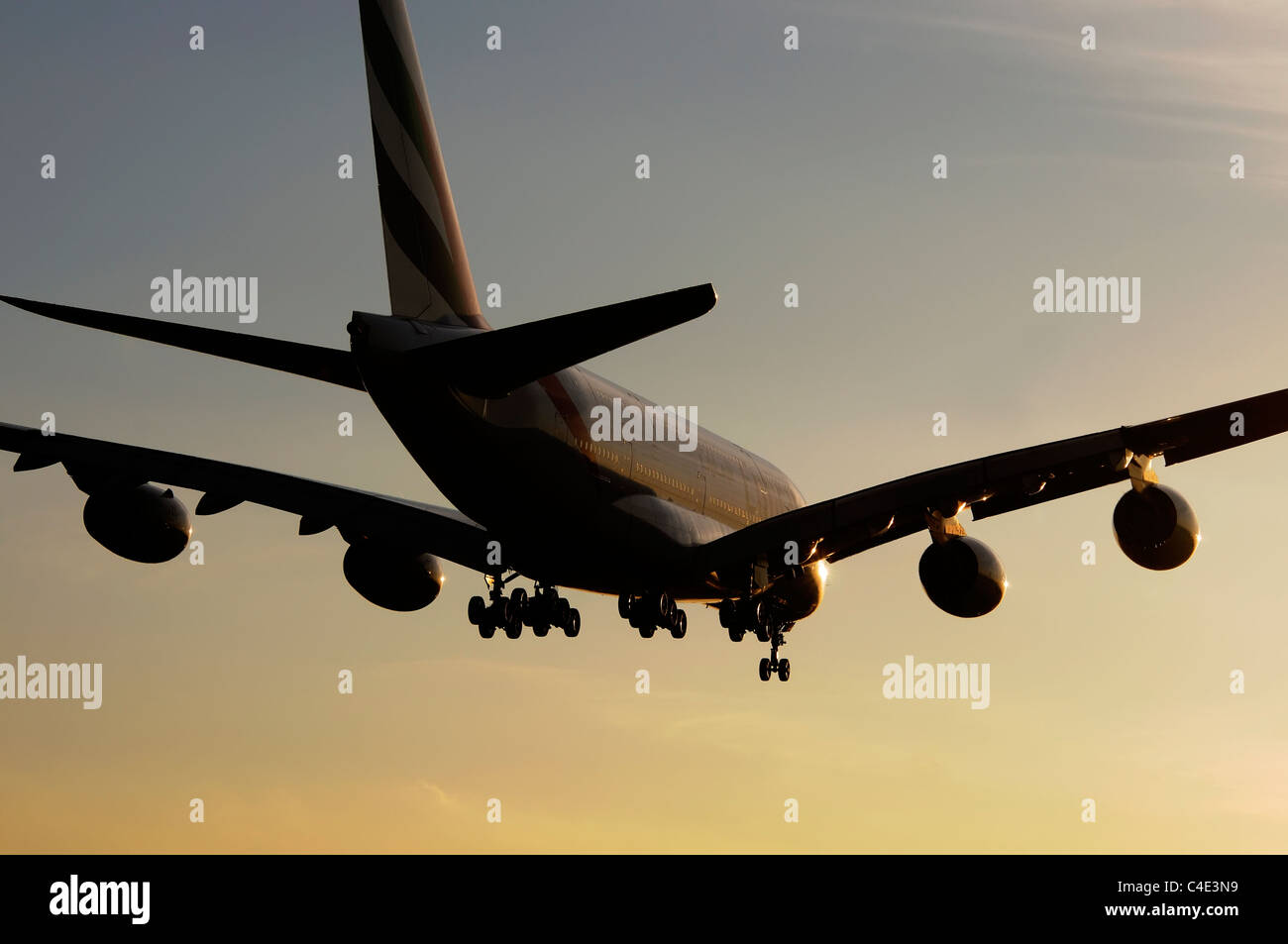 The Airbus A380 landing in the sunset Stock Photo - Alamy
