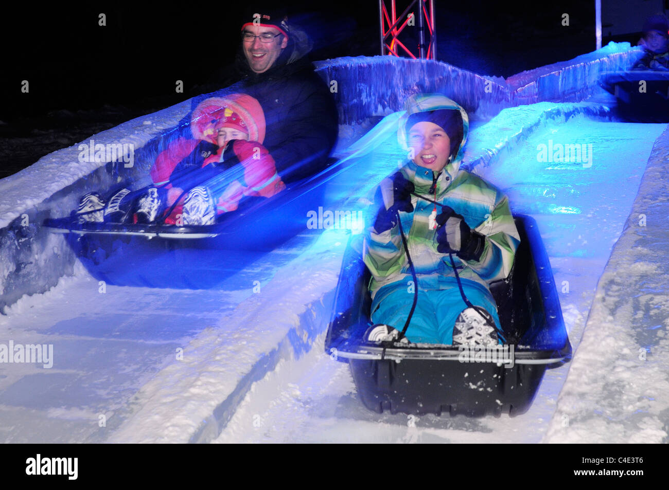 A family tobogganing on an ice run in Quebec, Canada Stock Photo - Alamy