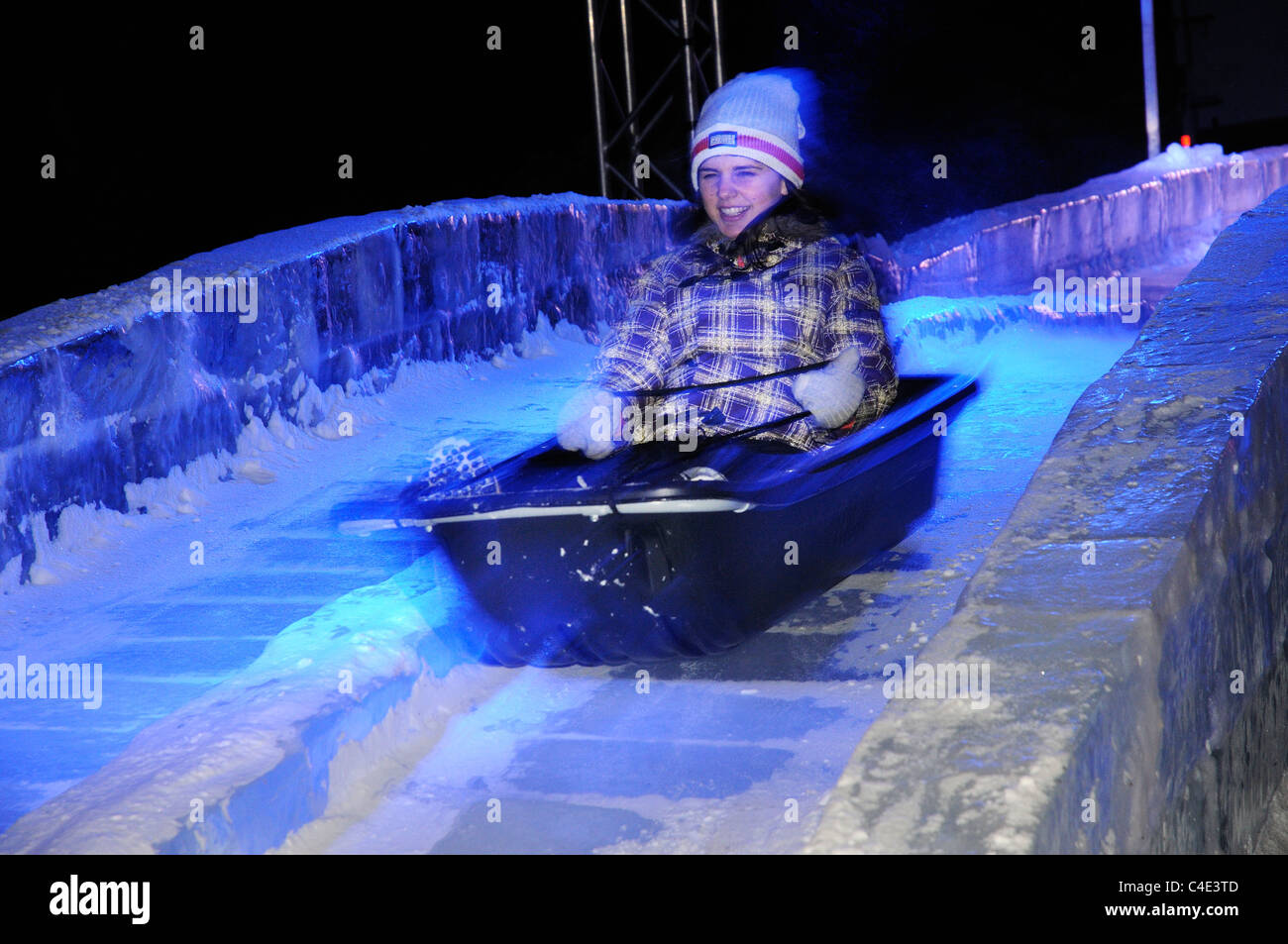 A child tobogganing on an ice run in Quebec, Canada Stock Photo - Alamy