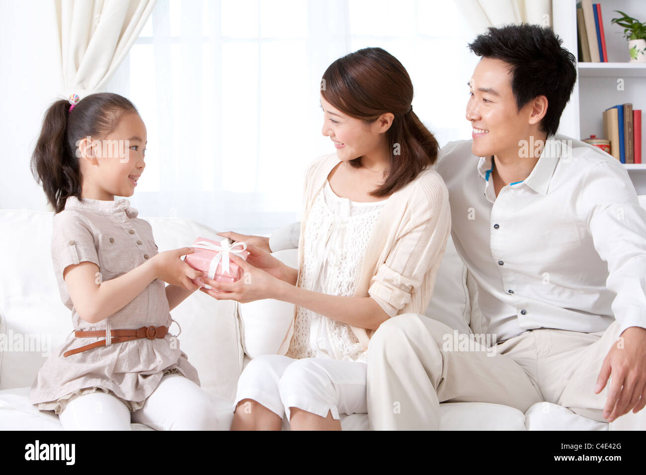 Giving Gifts to Parents Stock Photo - Alamy