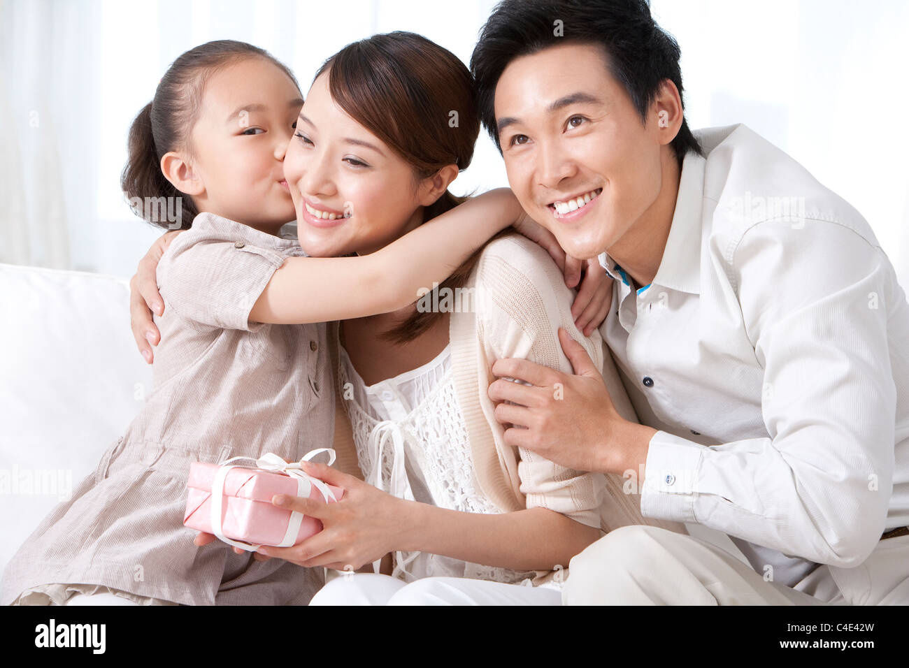 Happy Family Embracing Stock Photo - Alamy