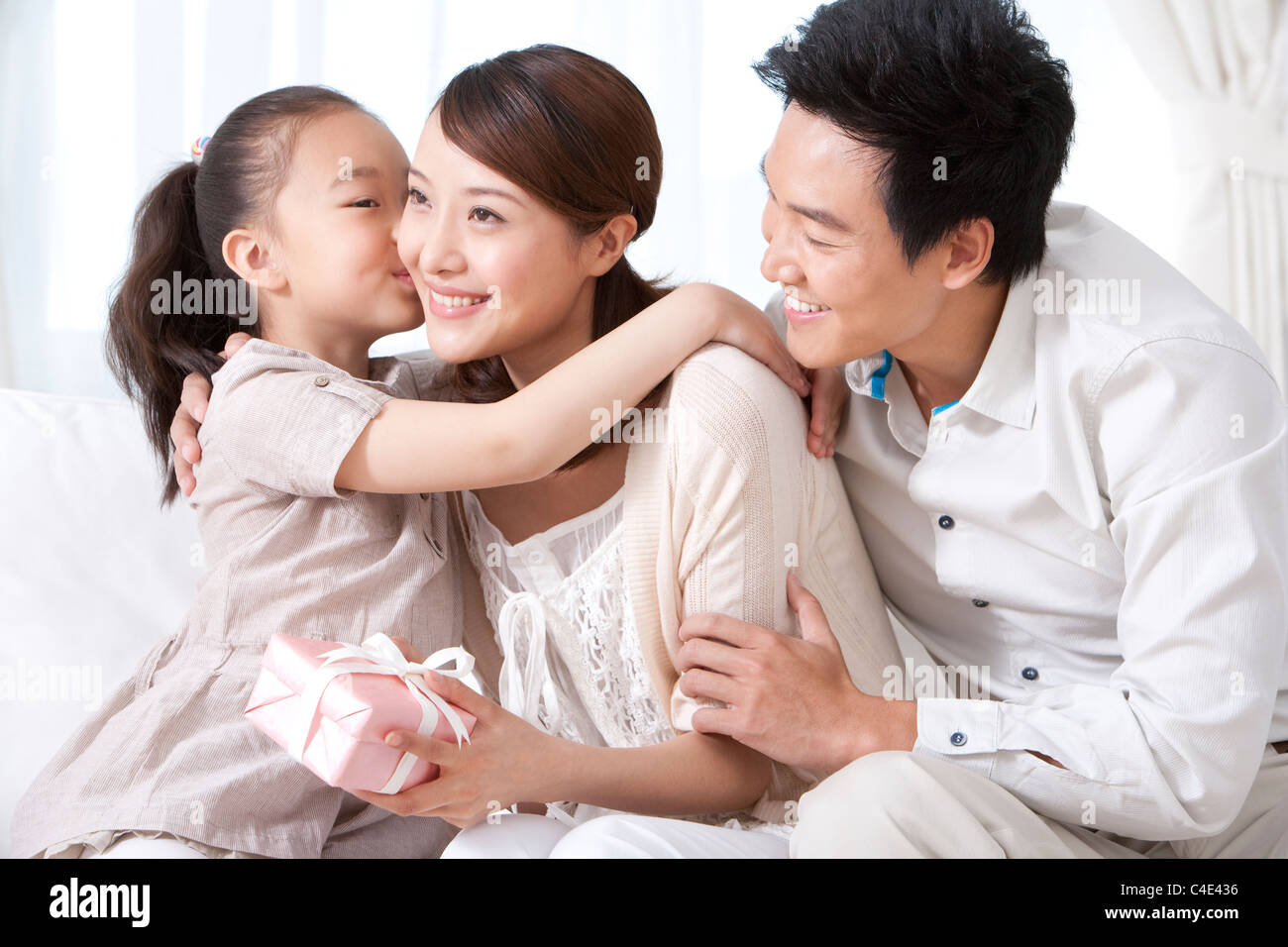 Happy Family Embracing Stock Photo - Alamy