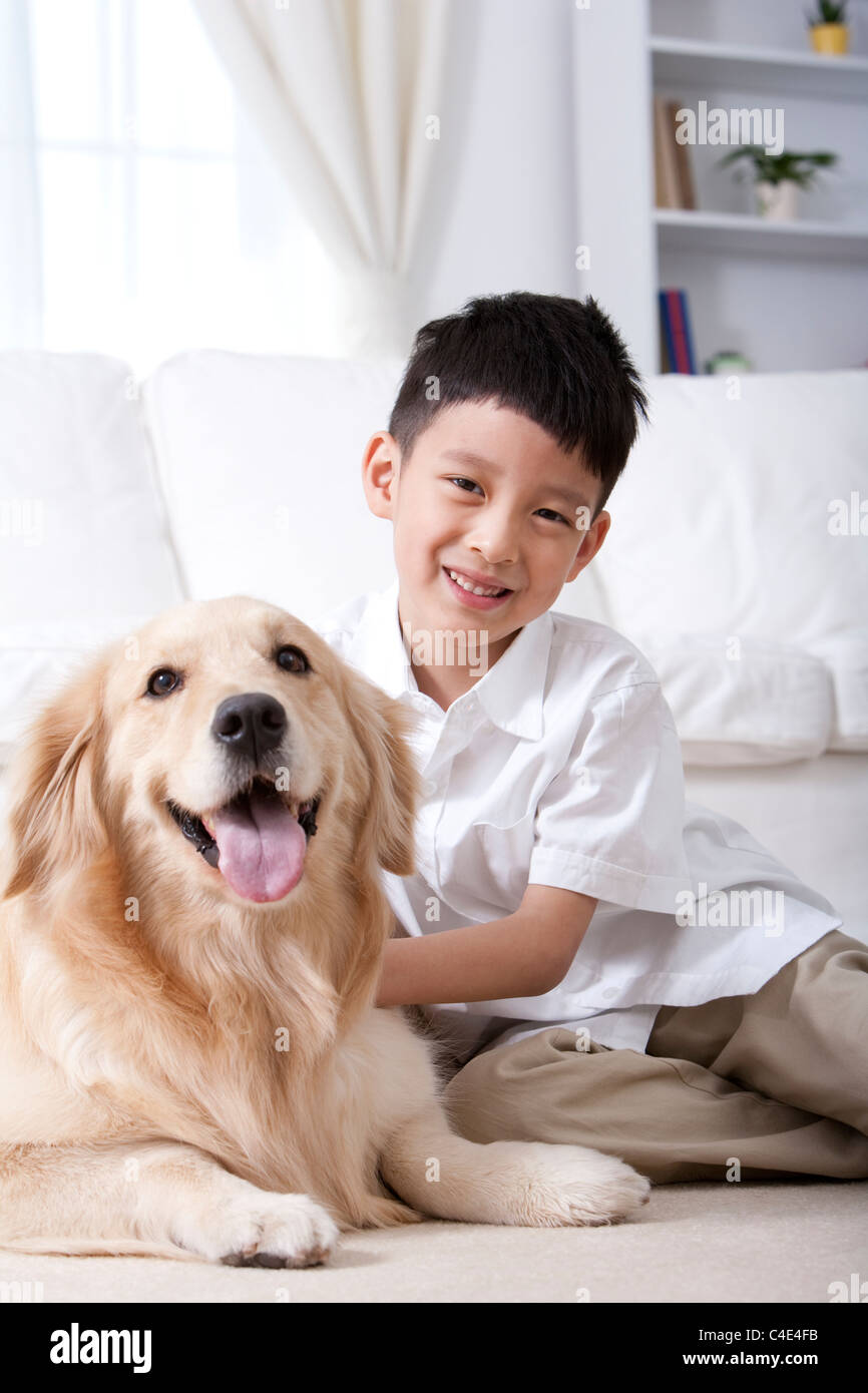 Young Boy Hugging Dog Stock Photo - Alamy