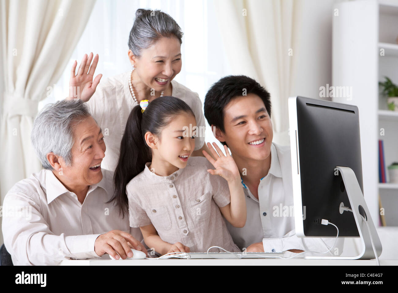 Video chatting with grandchild hi-res stock photography and images - Alamy