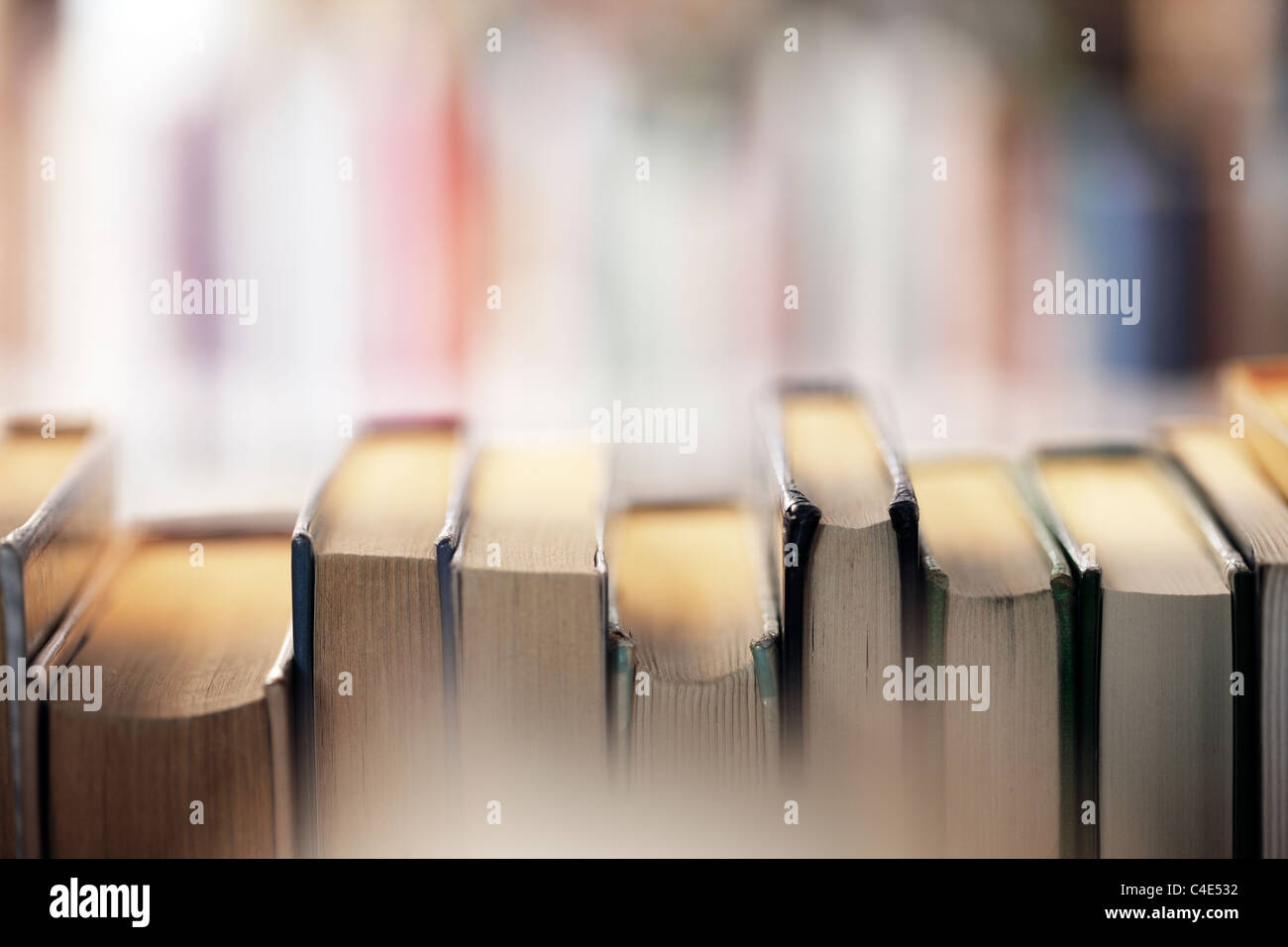 Books on a library shelf Stock Photo - Alamy