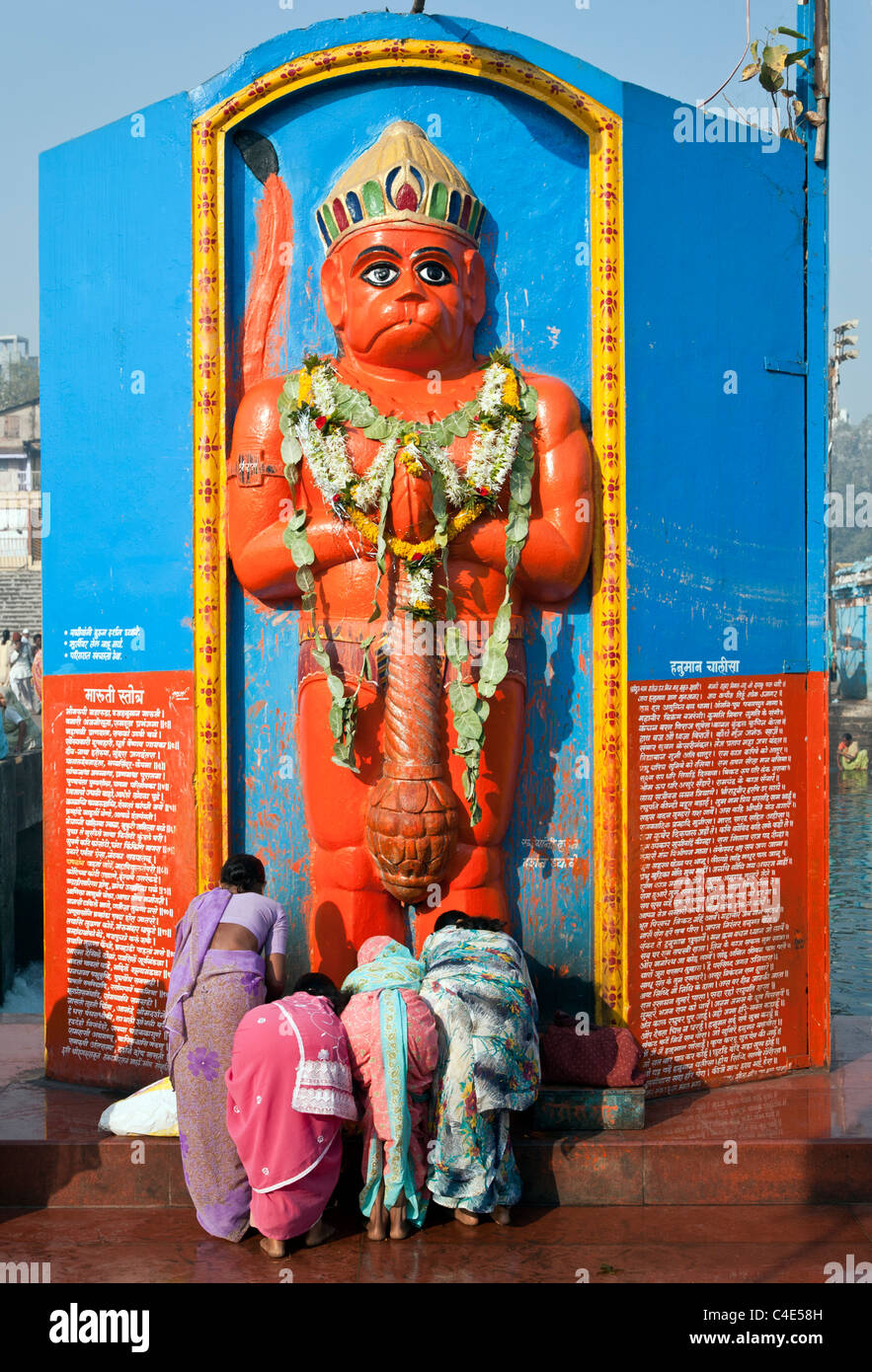 Women worshiping Hanuman statue (monkey god). Ram Kund. Nasik ...