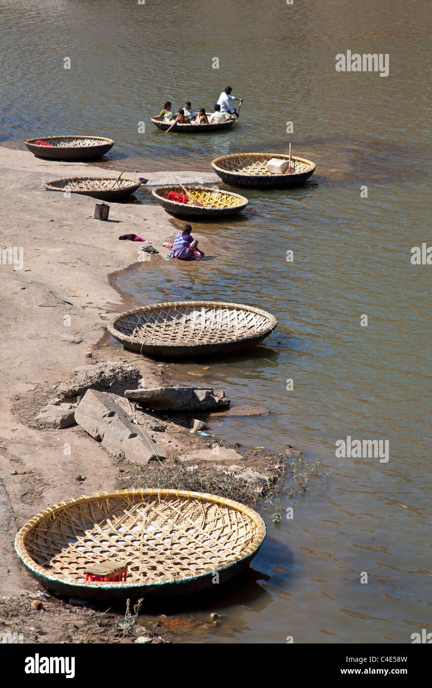 Coracles (traditional bamboo round boats). Tungabhadra river. Hampi ...