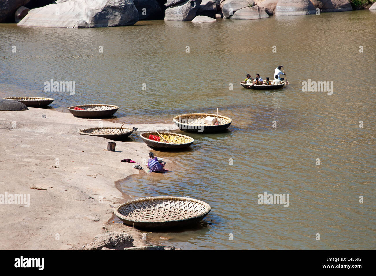 Coracles (traditional bamboo round boats). Tungabhadra river. Hampi ...