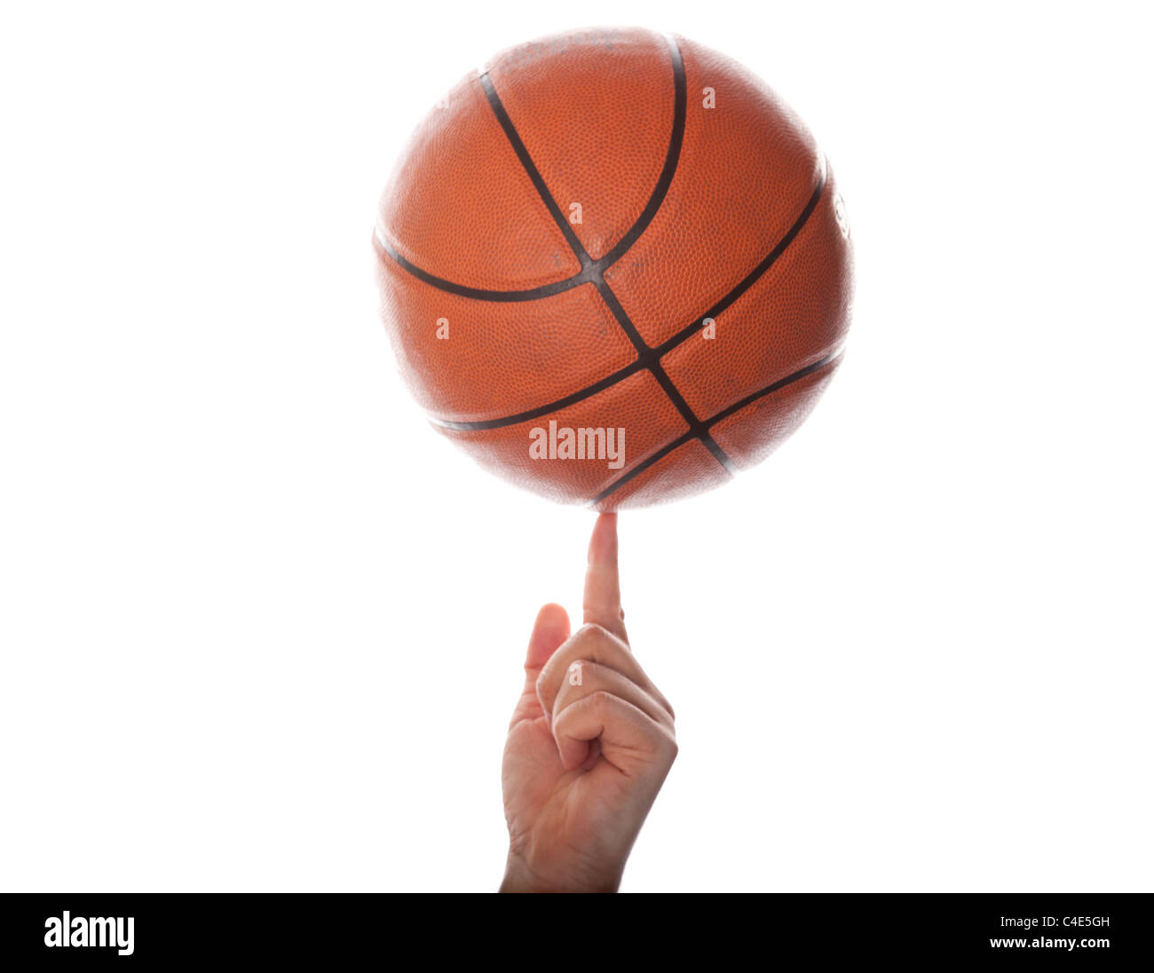 The isolated image of a hand and basketball ball on a white background ...