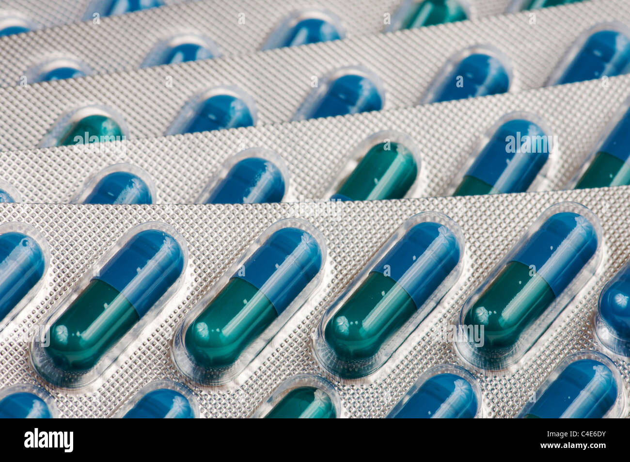 group capsules packed green and blue Stock Photo - Alamy