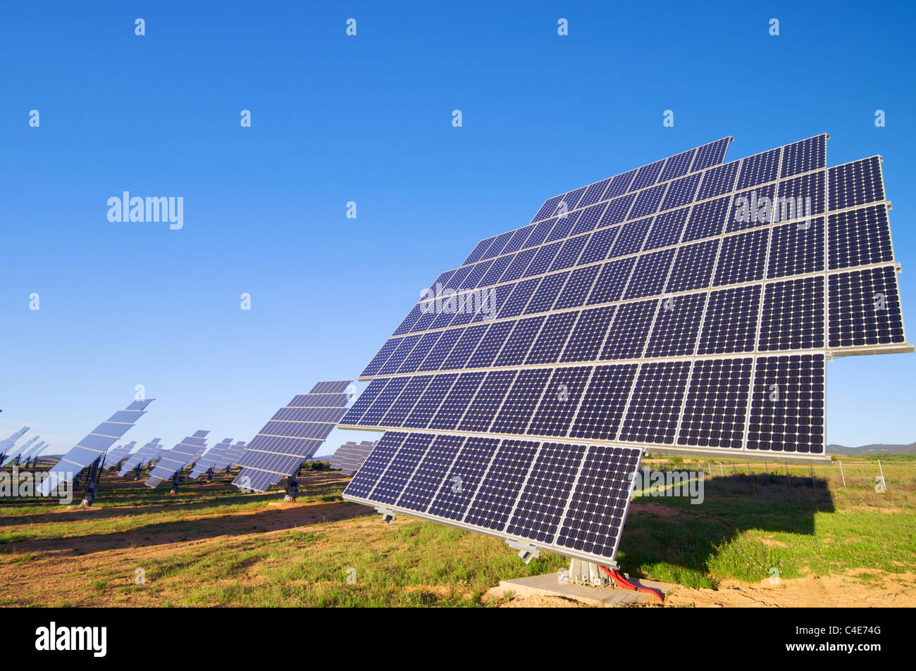 Solar field with blue sky Stock Photo - Alamy