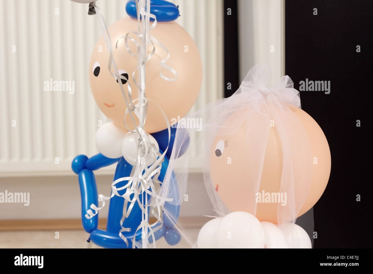 Helium inflated balloons in form of bride and groom profile shot Stock ...
