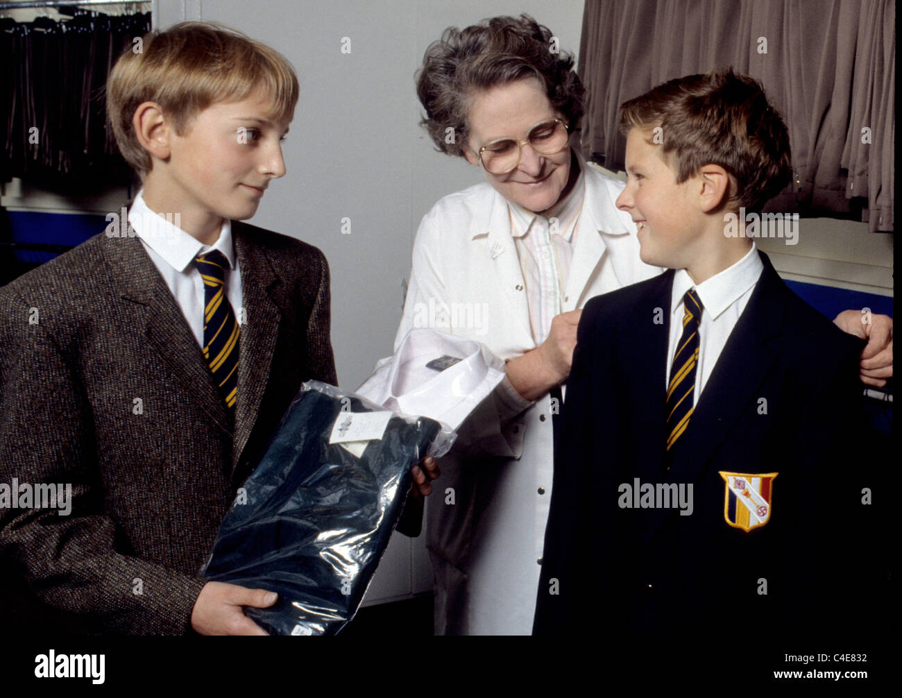 Being fitted with school uniform at a private public school Stock Photo ...