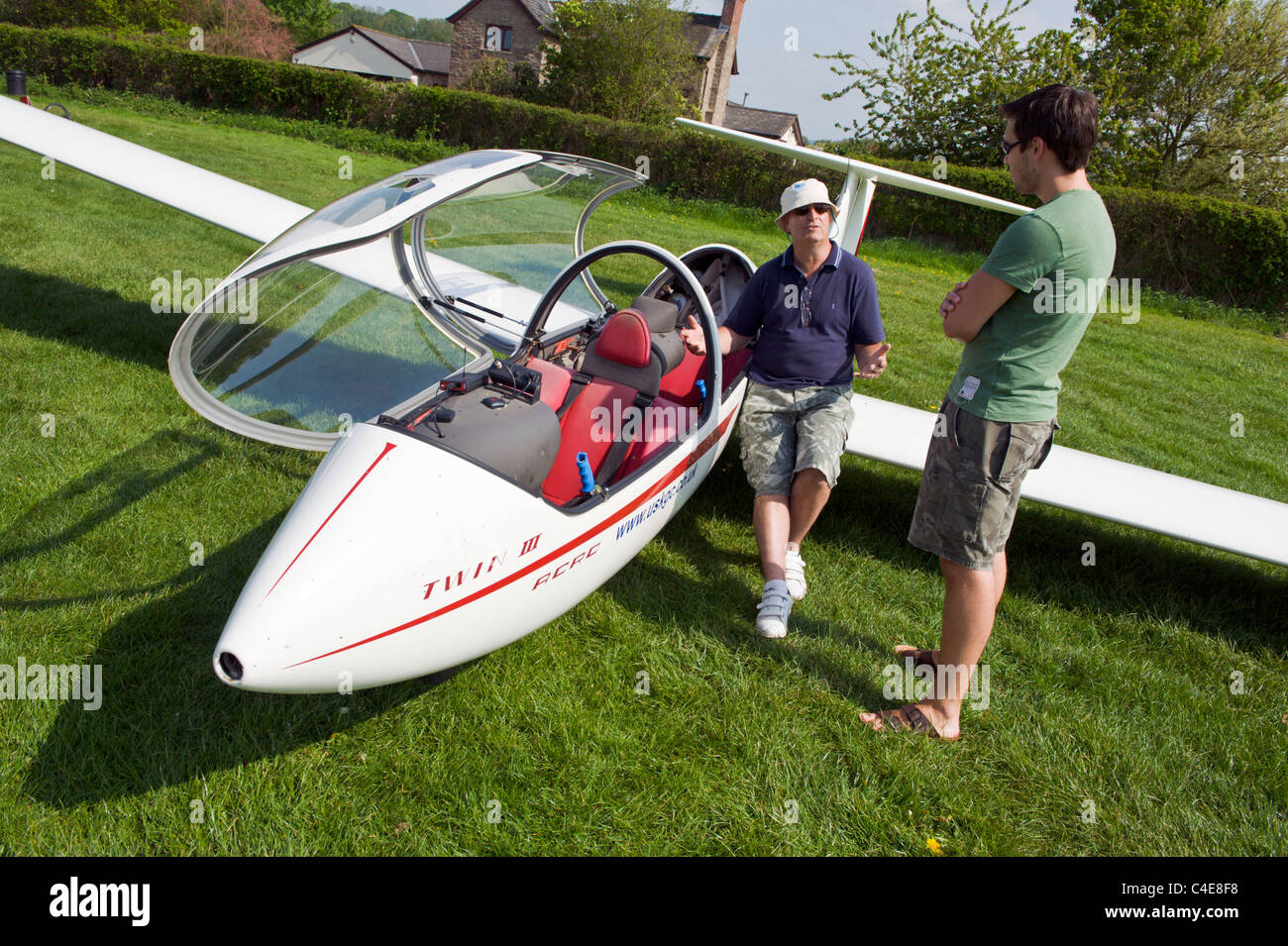 Young man receiving instruction before having first flight in two ...