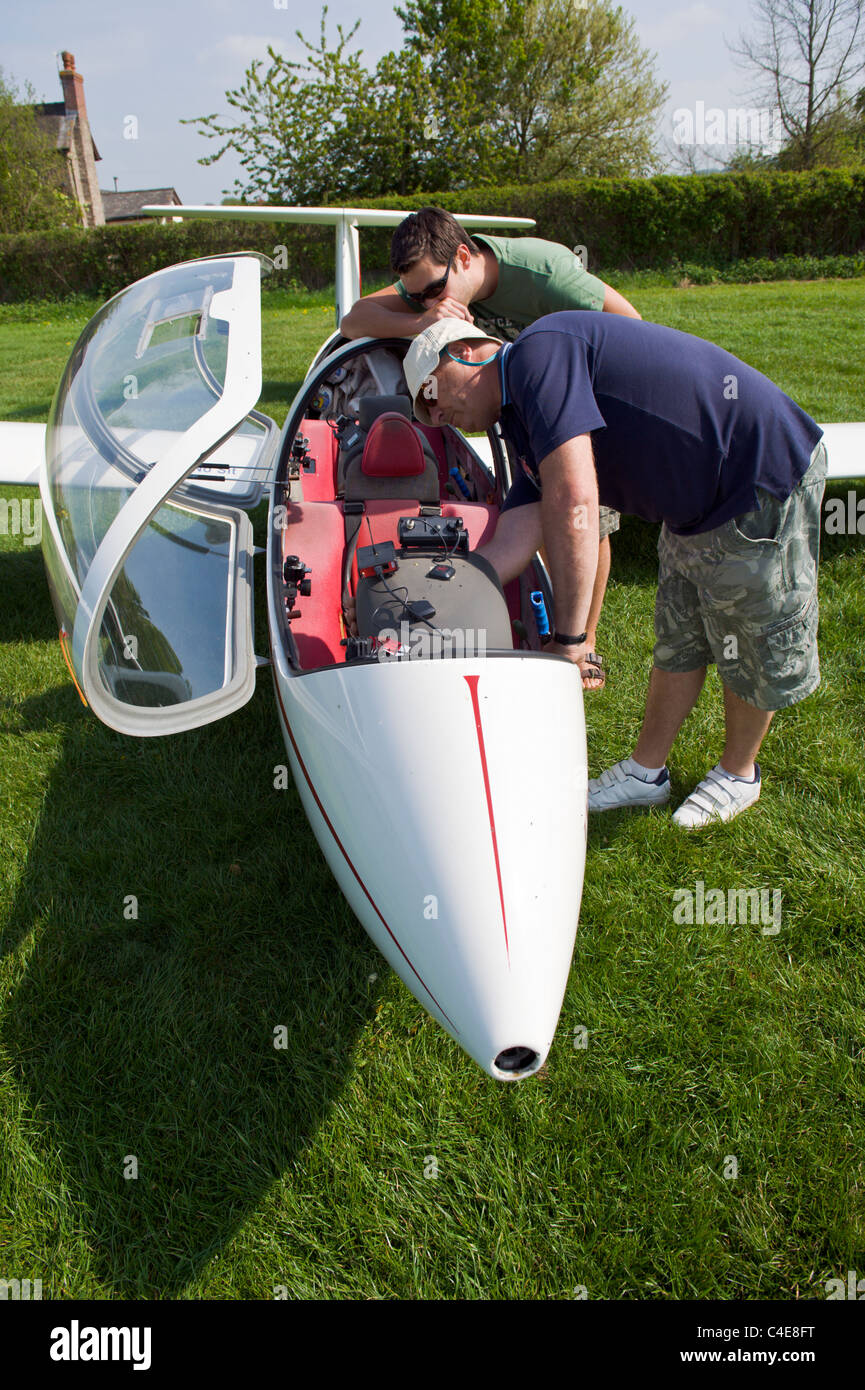 Young man receiving instruction before having first flight in two ...