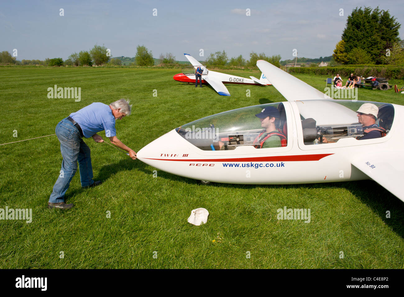 Ground crew attaching cable from tug aircraft glider Stock Photo - Alamy