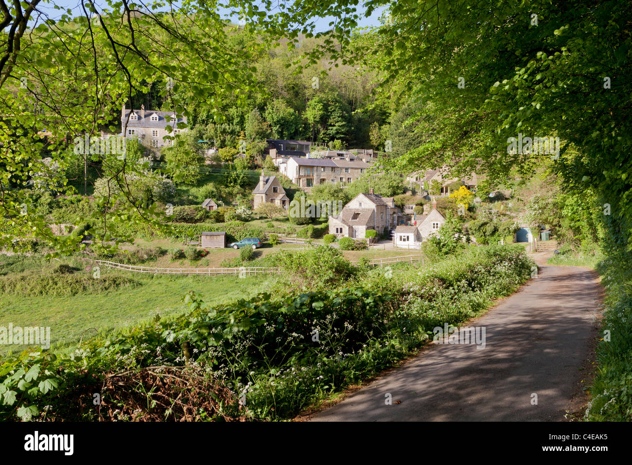 Evening light in the Slad Valley falling on the Cotswold hamlet of ...