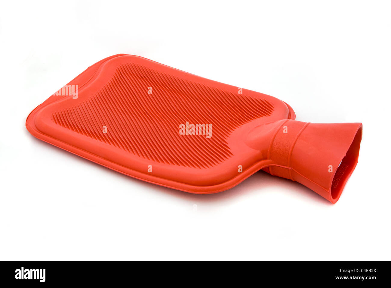 Red hot water bottle isolated on white Stock Photo - Alamy