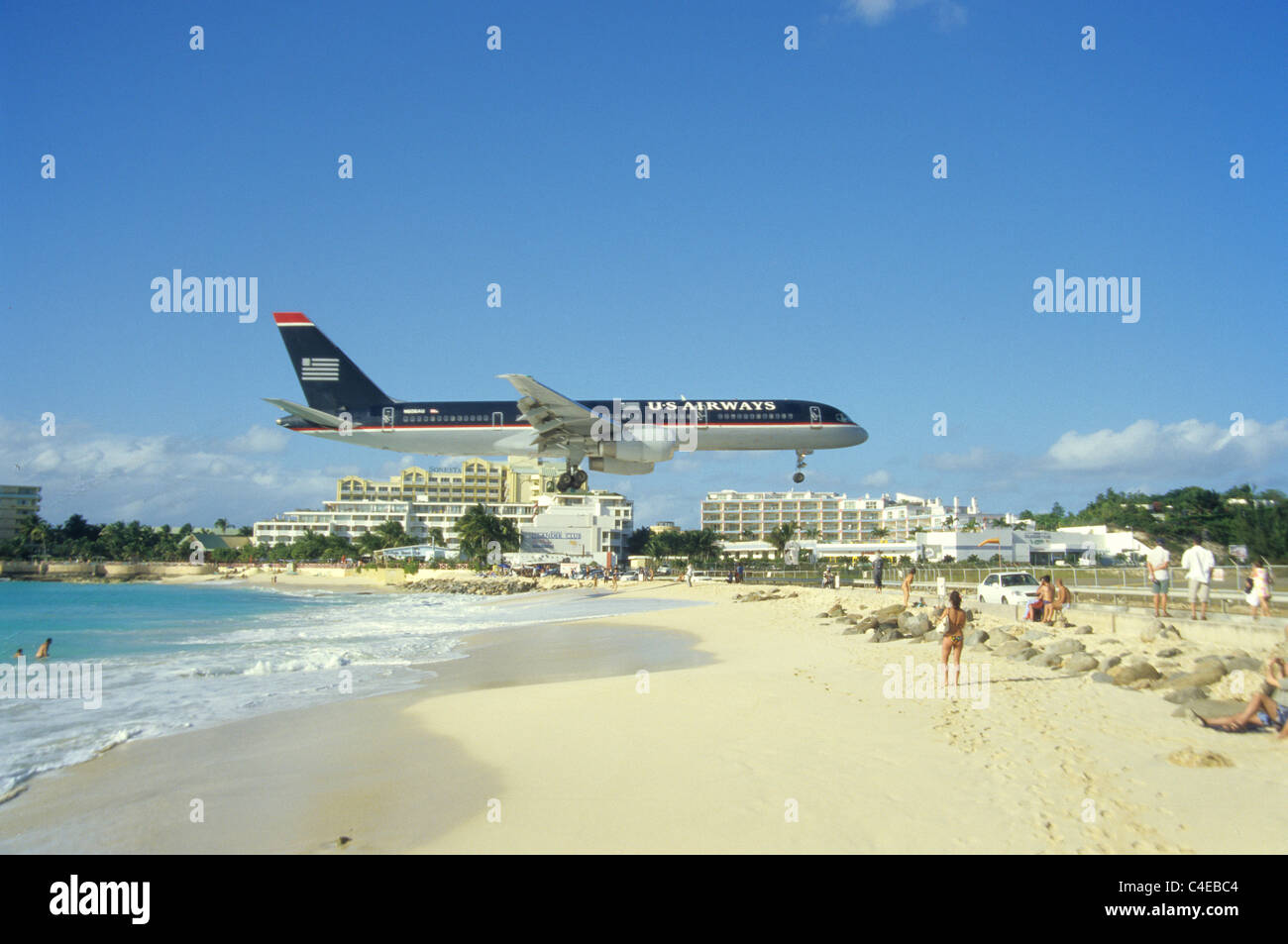 U.S. Airways airplane landing, flying close over Maho Beach, St. Martin ...