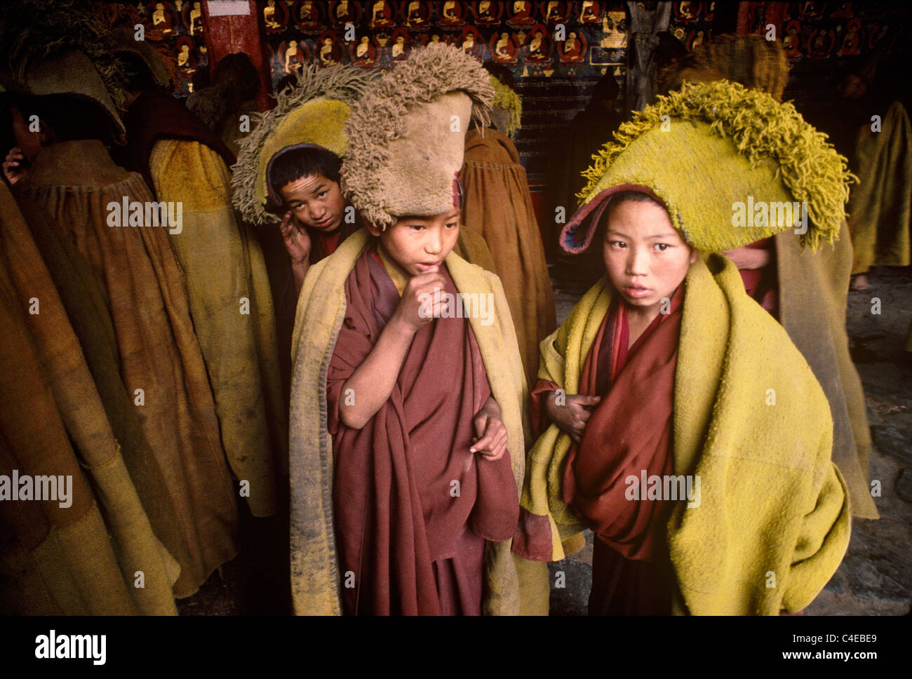 Young Gelugpa monks, wearing the distinctive yellow hats of the sect ...