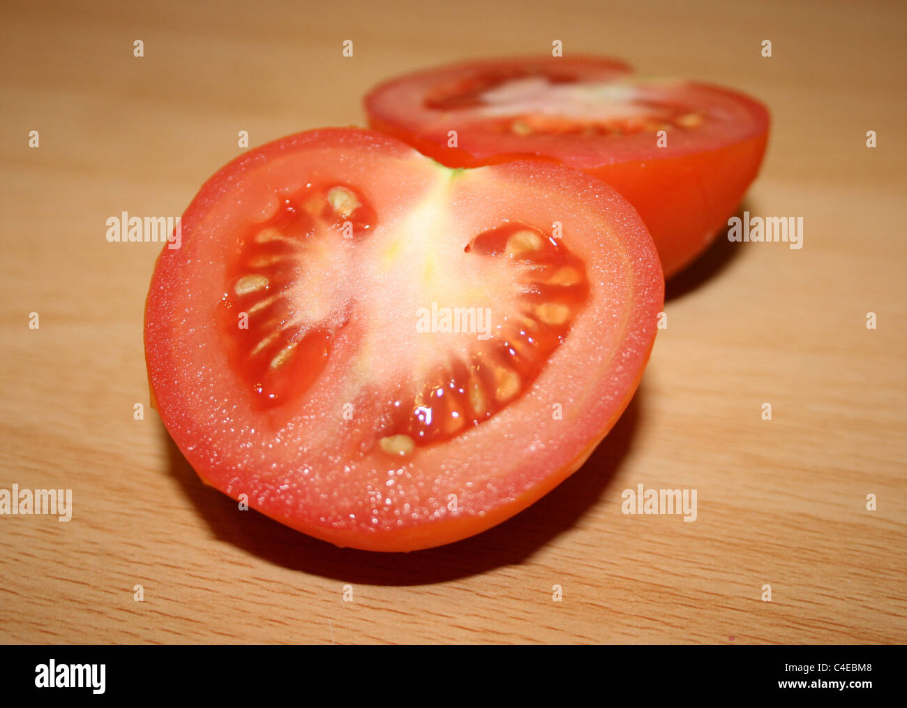Tomato cut in half Stock Photo - Alamy