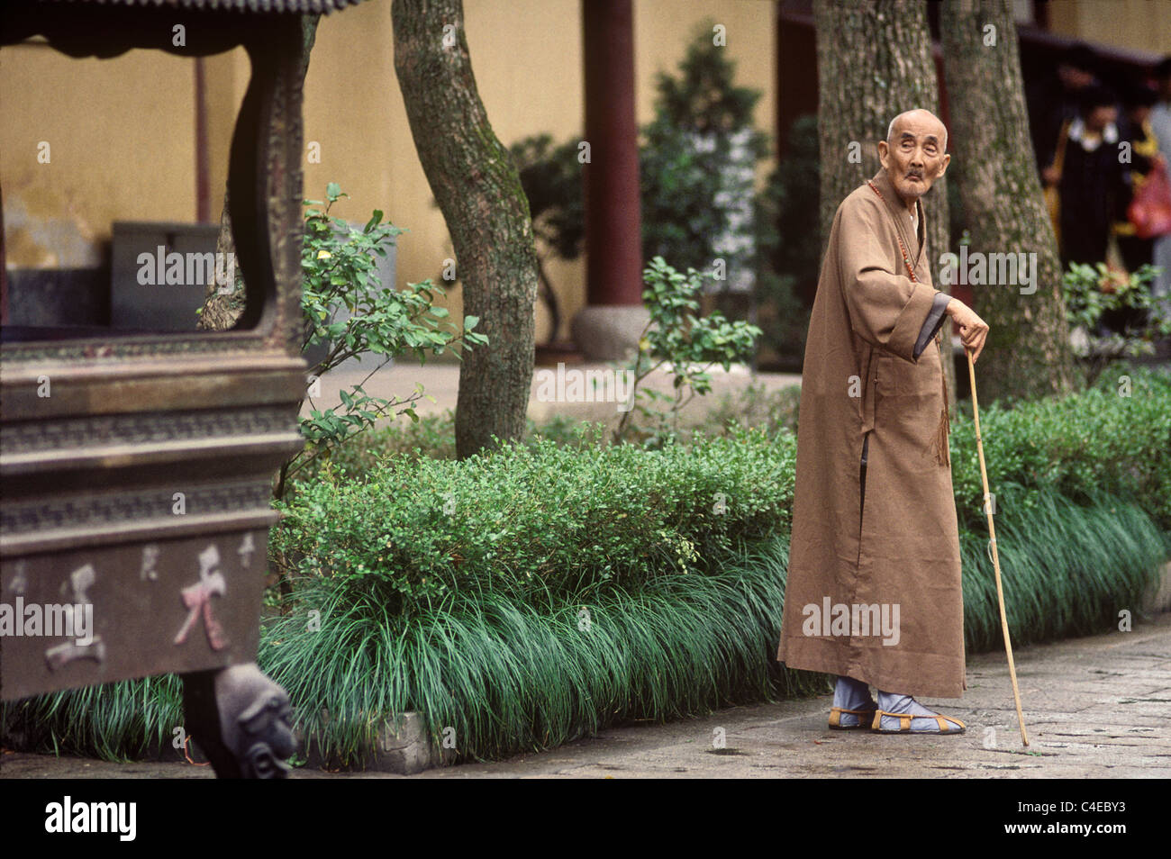 Monk visiting Puji temple. Putuoshan is the earthly abode of Guanyin ...