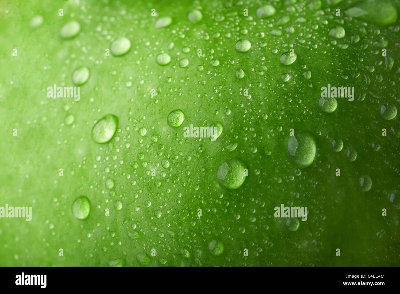 Water drop on green apple surface Stock Photo - Alamy