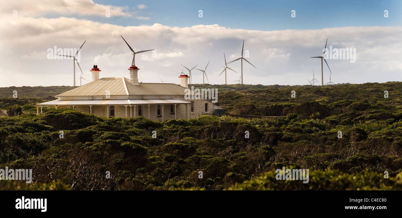 wind generators behind old house Stock Photo - Alamy