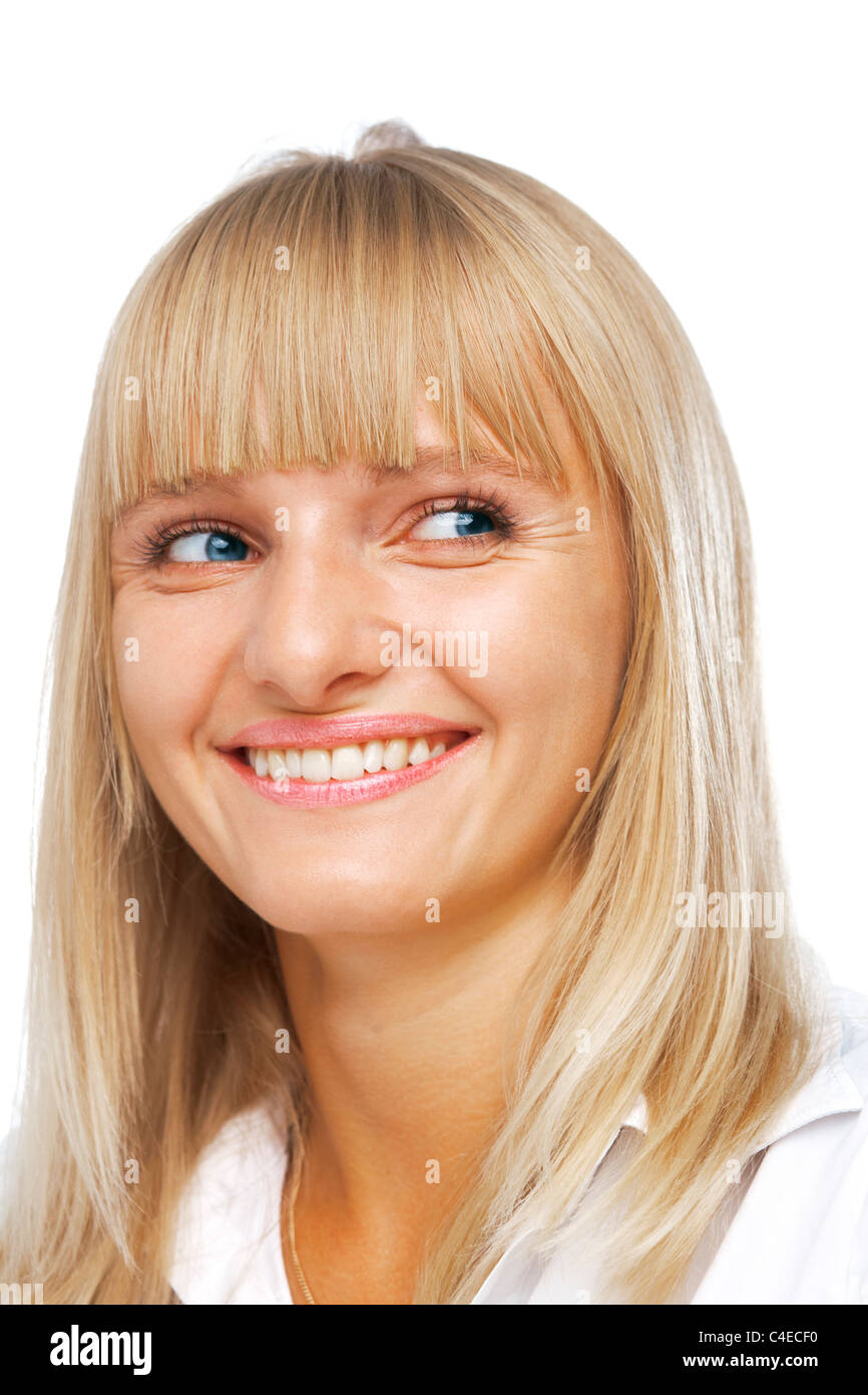 Beautiful young woman smiling and looking away over white background ...